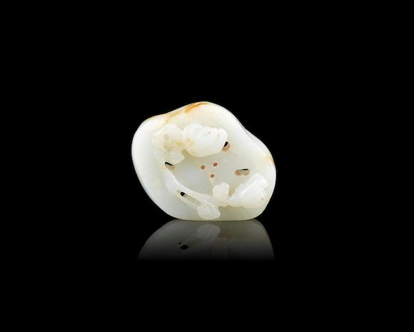 Bonhams : A reticulated pale green and russet jade 'lotus pod and ...