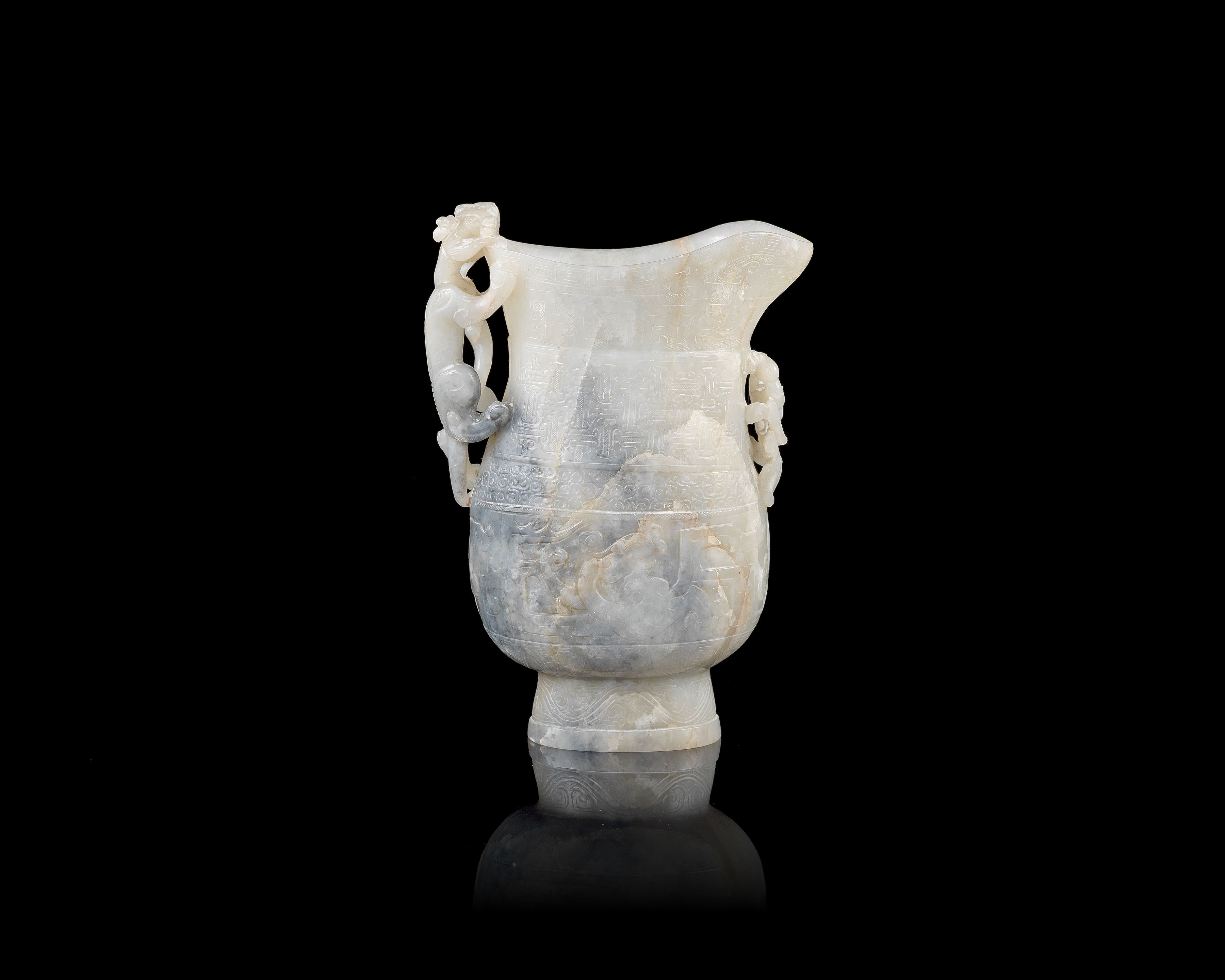 Bonhams : A pale green and grey jade archaistic pouring vessel, gong ...