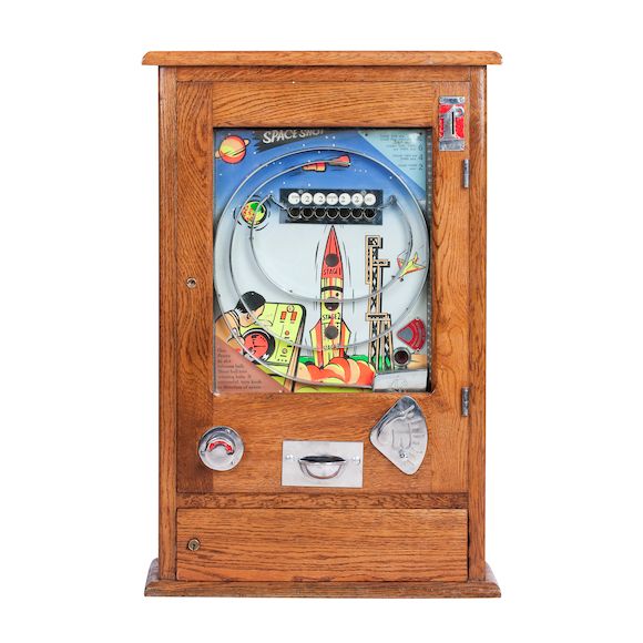 Bonhams : A mid-20th century oak cased 'space shot' slot machine