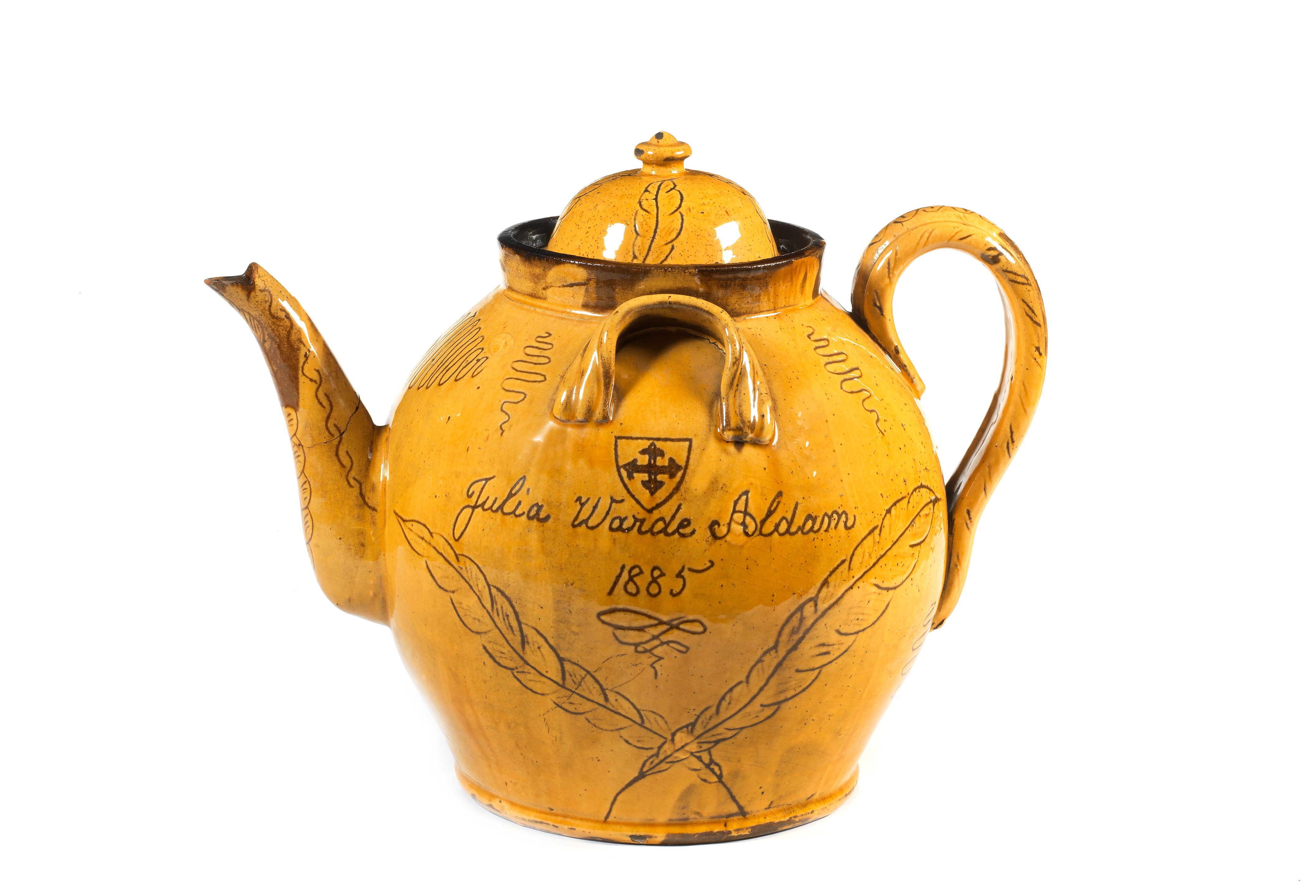 Bonhams : A massive slipware teapot and cover, dated 1885