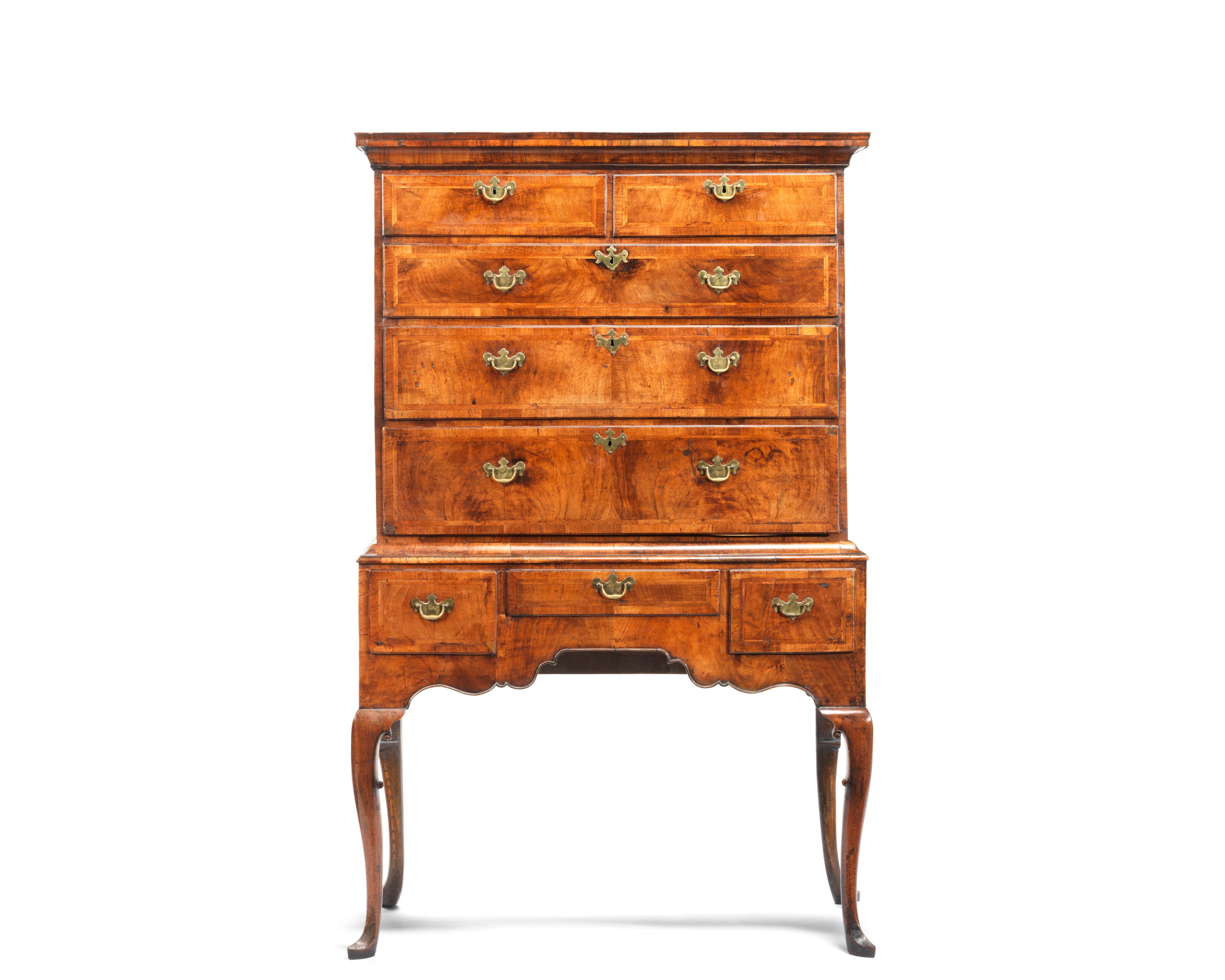 Bonhams : A George I walnut crossbanded and featherbanded chest on stand