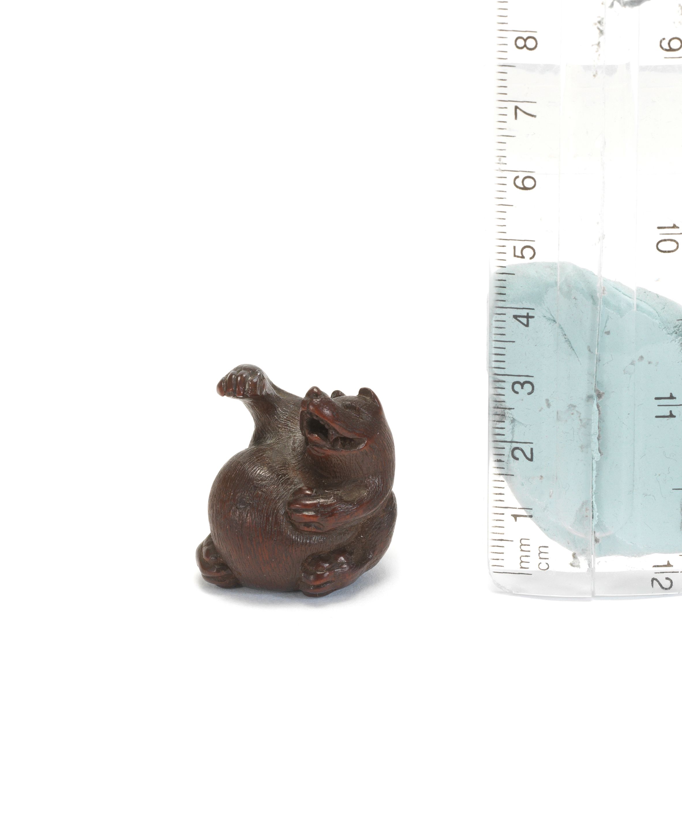 Bonhams : A wood netsuke of a tanuki (Japanese raccoon dog) By Kokei ...