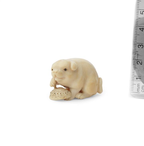 Bonhams : An ivory netsuke of a puppy By Okatori, Kyoto, early 19th century