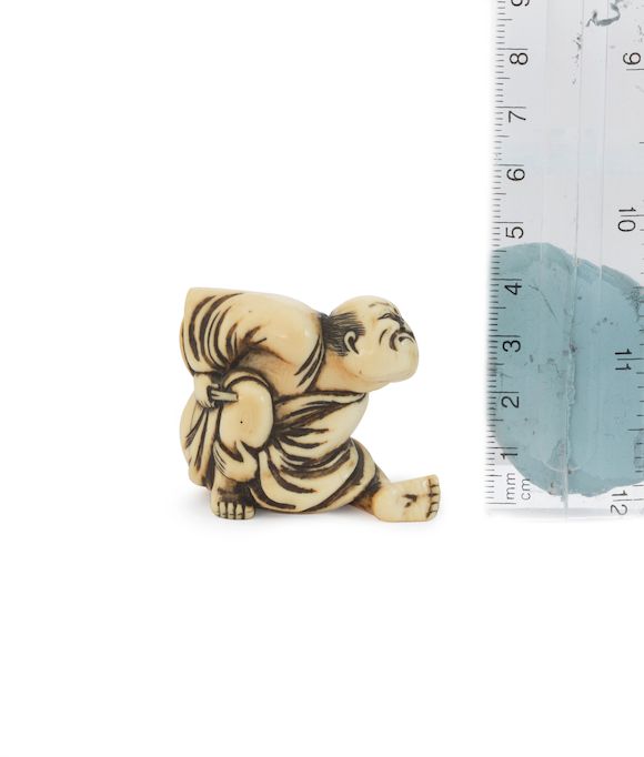 Bonhams : An ivory netsuke of a man applying moxa (dried mugwort for ...