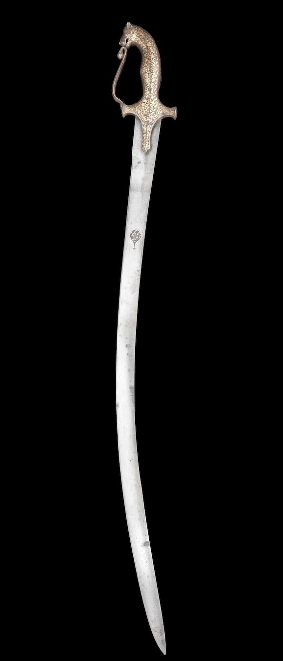 Bonhams : A tiger-head-hilted steel sword (shamshir) India, 19th Century