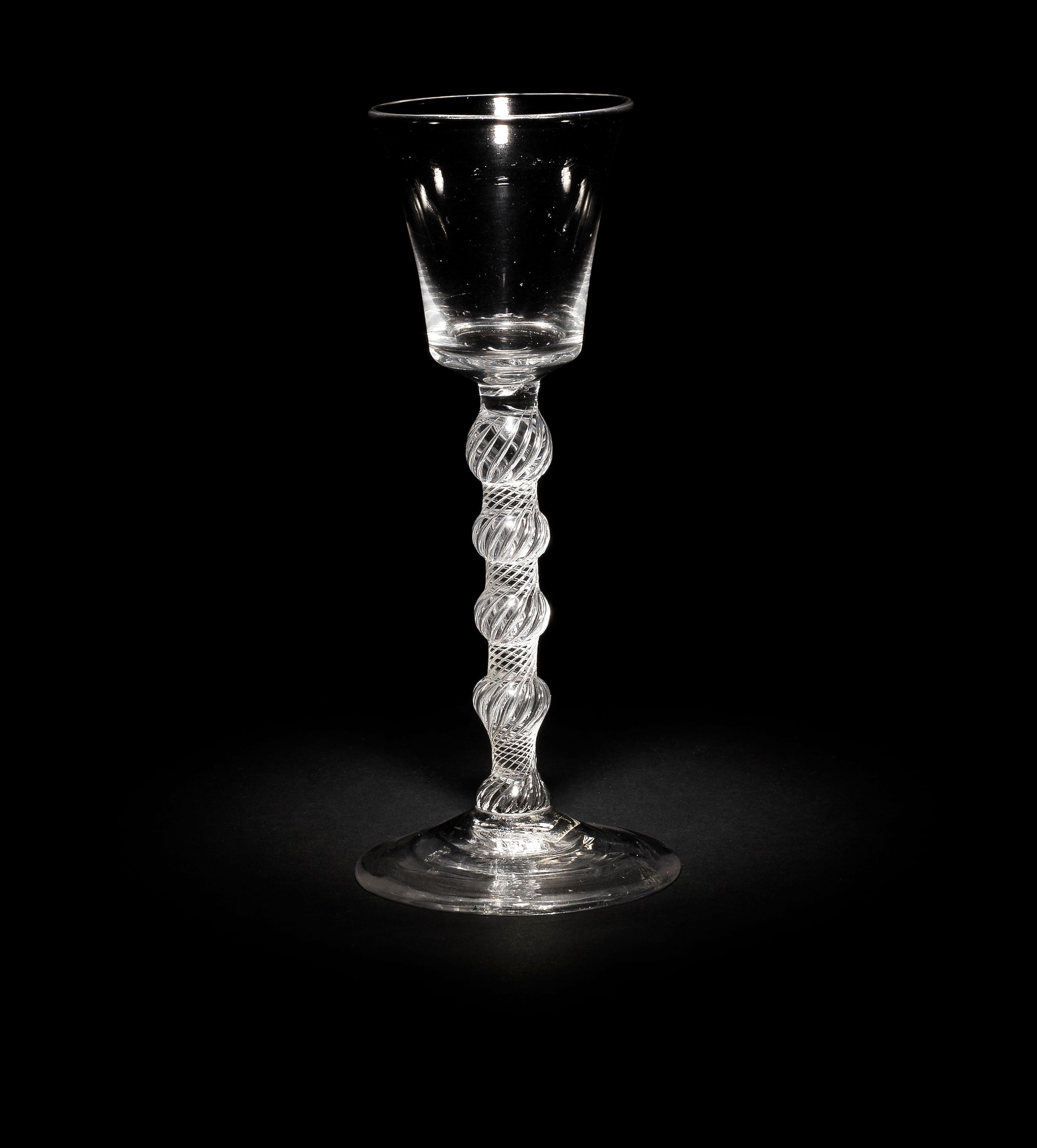 Bonhams : A very rare five-knopped airtwist wine glass, circa 1750