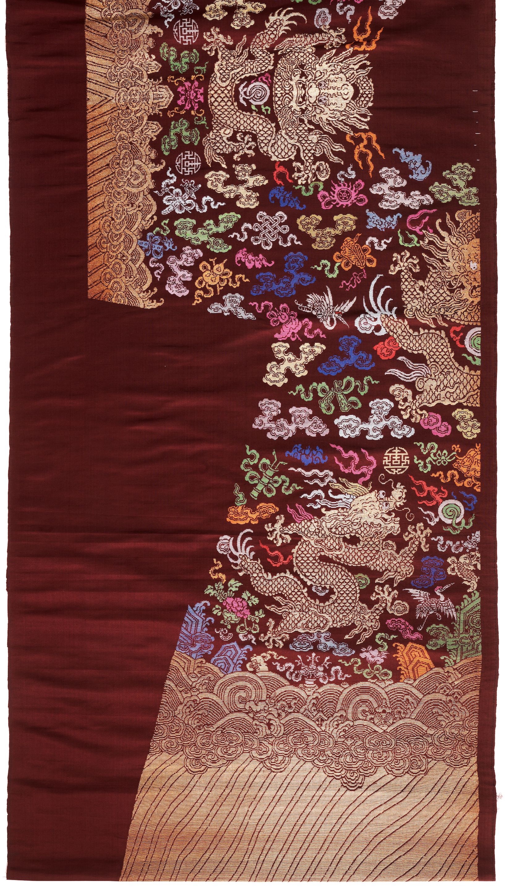 Bonhams : A part-uncut burgundy-ground silk dragon robe Late Qing Dynasty