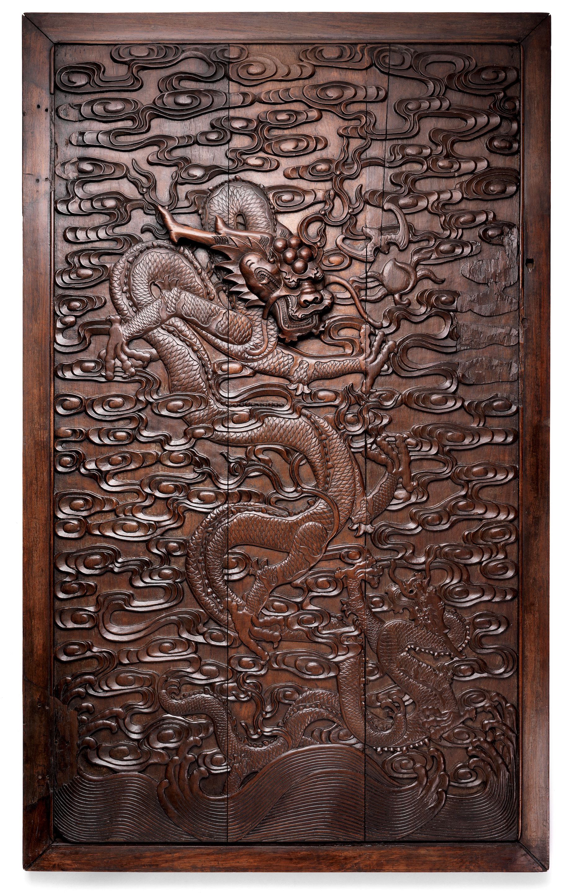 Bonhams : A rare large huanghuali 'dragon' panel Mid Qing Dynasty