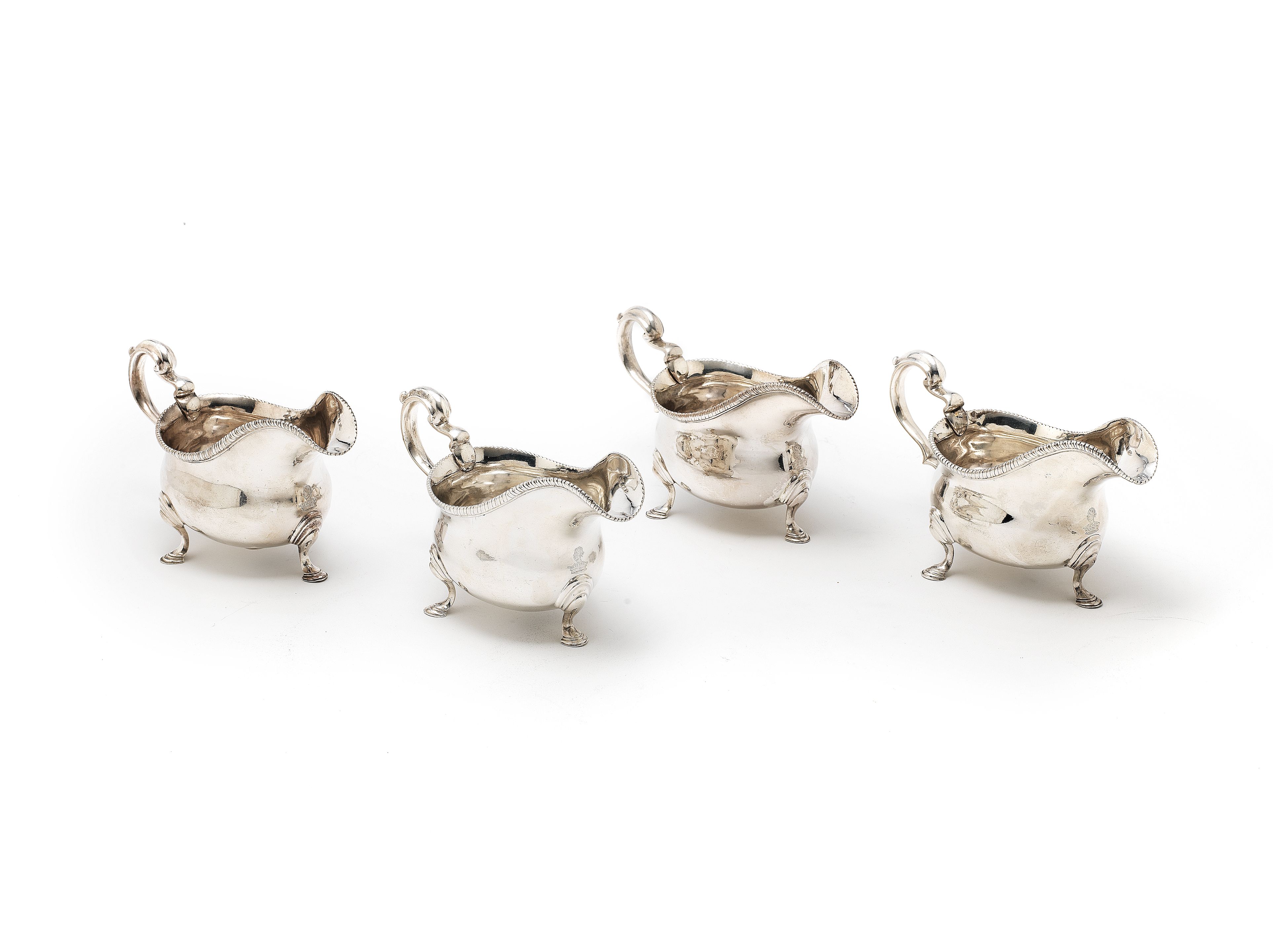 Bonhams : A set of four George III silver sauce boats by John Parker I ...