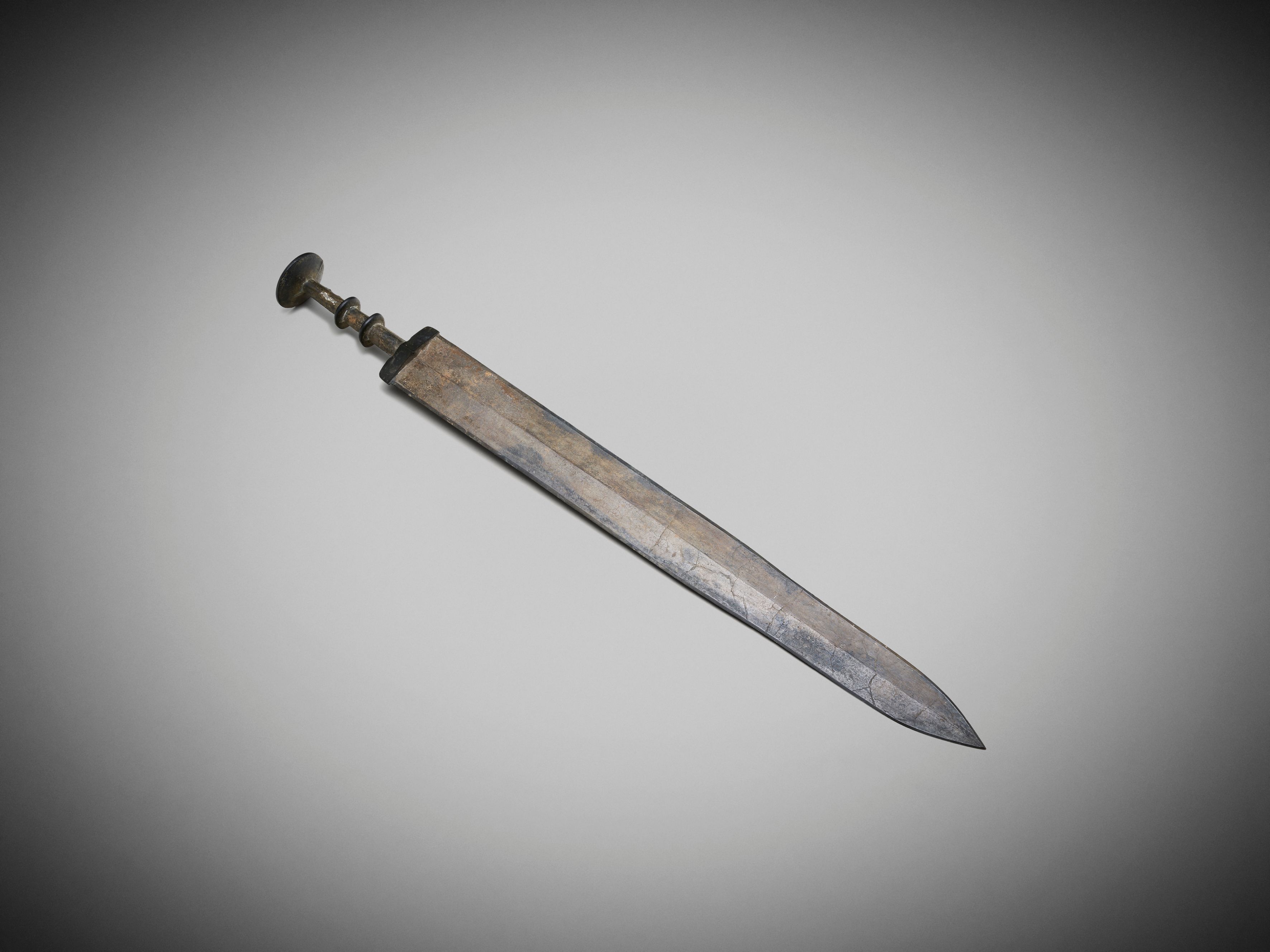 Bonhams : A Chinese zhou-style cast bronze single hand short sword, jian