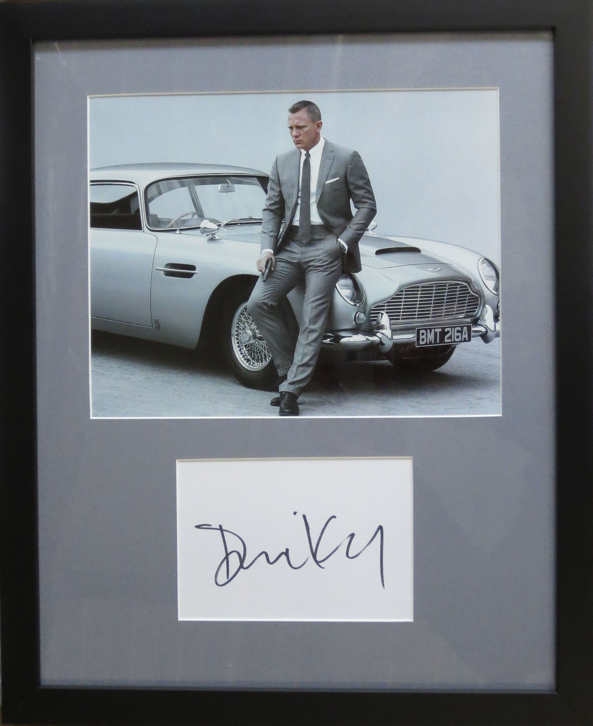 Bonhams Cars : A photograph with signature of Daniel Craig with the ...