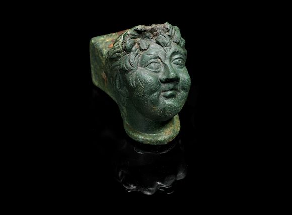 Bonhams : A Roman bronze protome head of a satyr