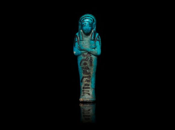 Bonhams : An Egyptian bright blue glazed composition shabti for Nest-t ...