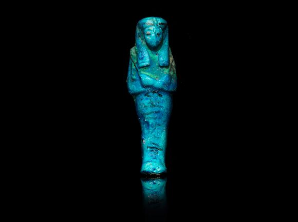 Bonhams : An Egyptian bright blue glazed composition shabti for Nes-Mut