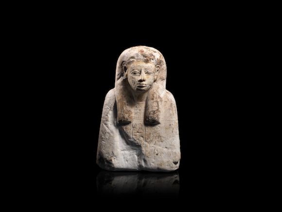 Bonhams : An Egyptian limestone anthropoid ancestor bust