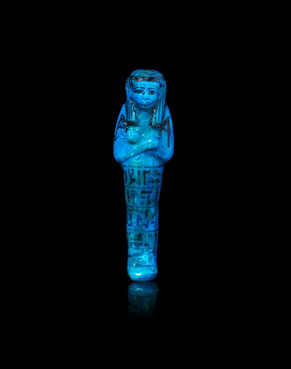 Bonhams : An Egyptian bright blue glazed composition shabti for Hor