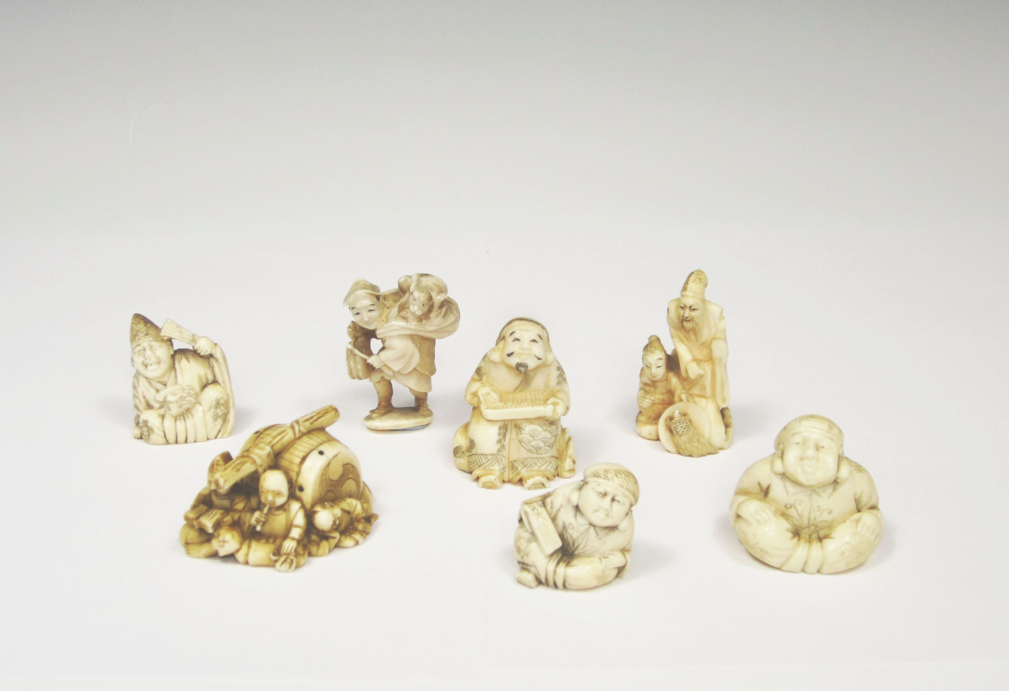 Bonhams : Seven ivory and marine ivory netsuke Meiji