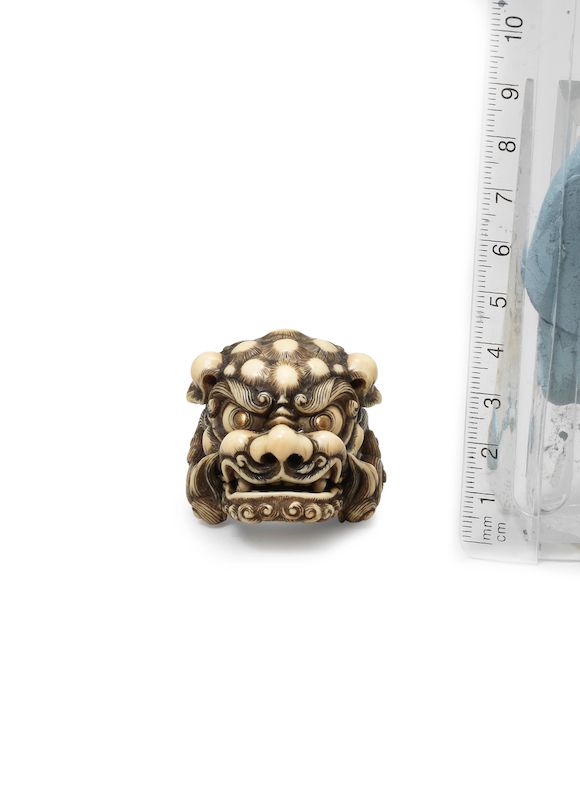 Bonhams : An ivory netsuke of a shishimai mask School of Tomotada ...