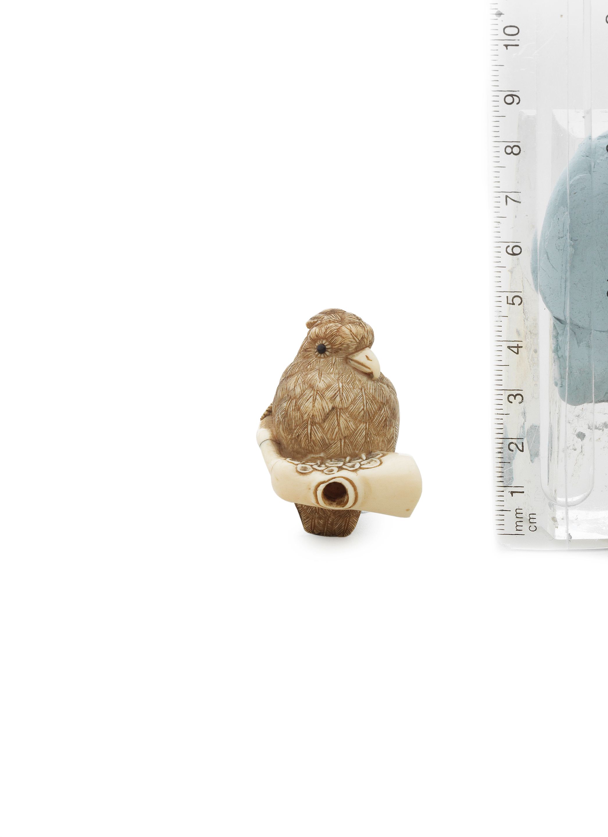 Bonhams : An ivory netsuke of a parrot 19th century