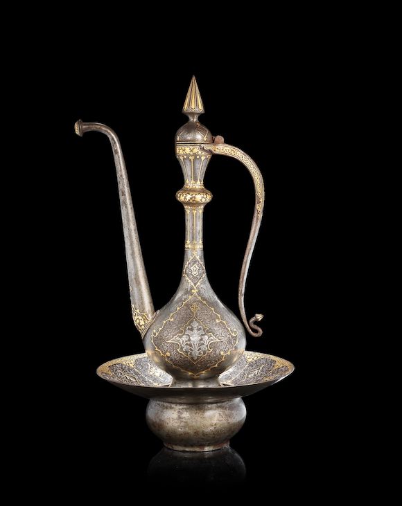 Bonhams : A Qajar gold and silver damascened steel ewer and basin ...