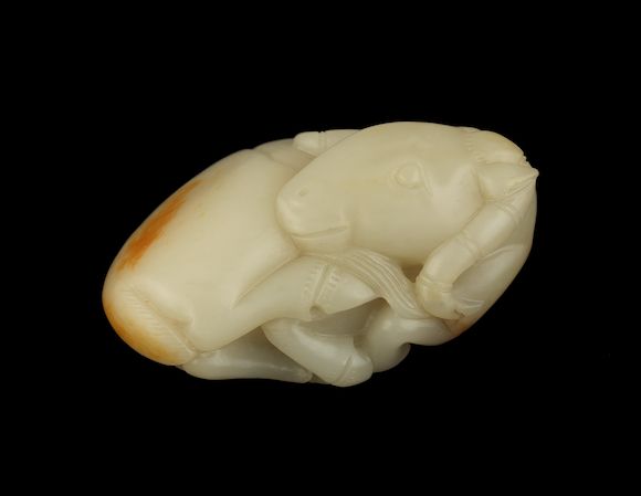 Bonhams : A pale green and russet jade carving of a ram 18th/19th century
