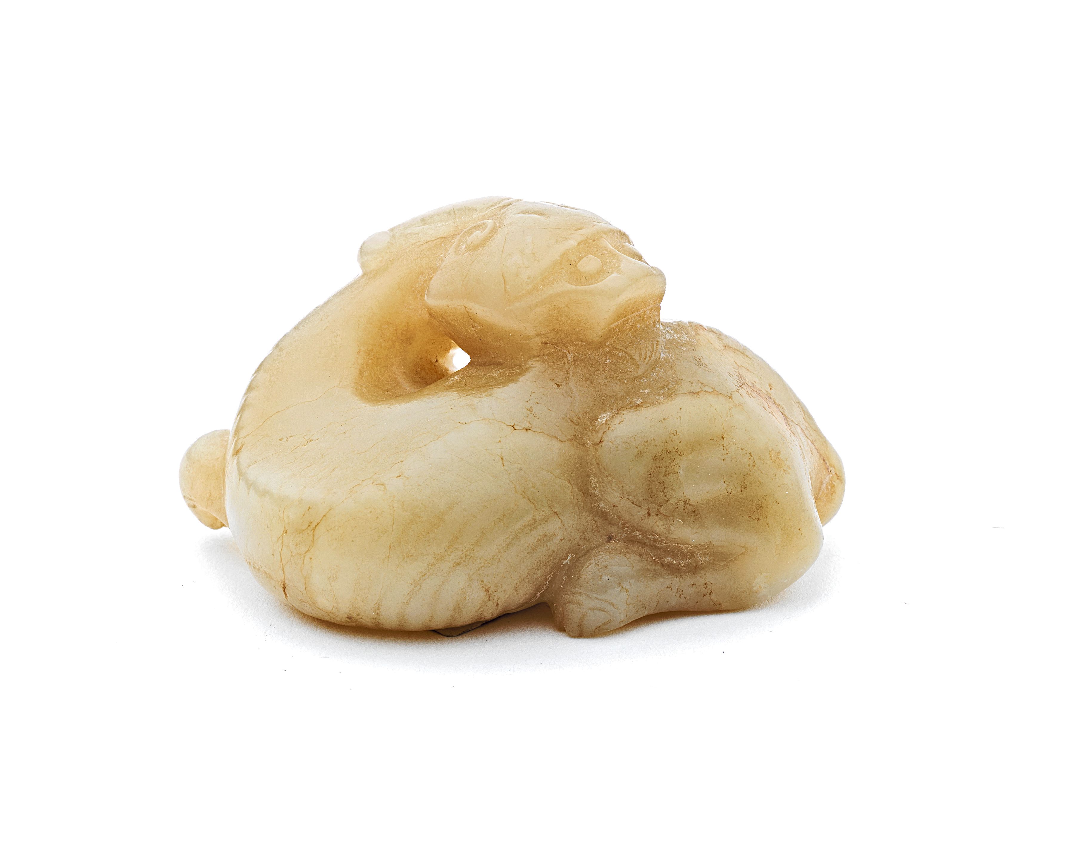 Bonhams : A YELLOW JADE CARVING OF A MYTHICAL BEAST Ming Dynasty