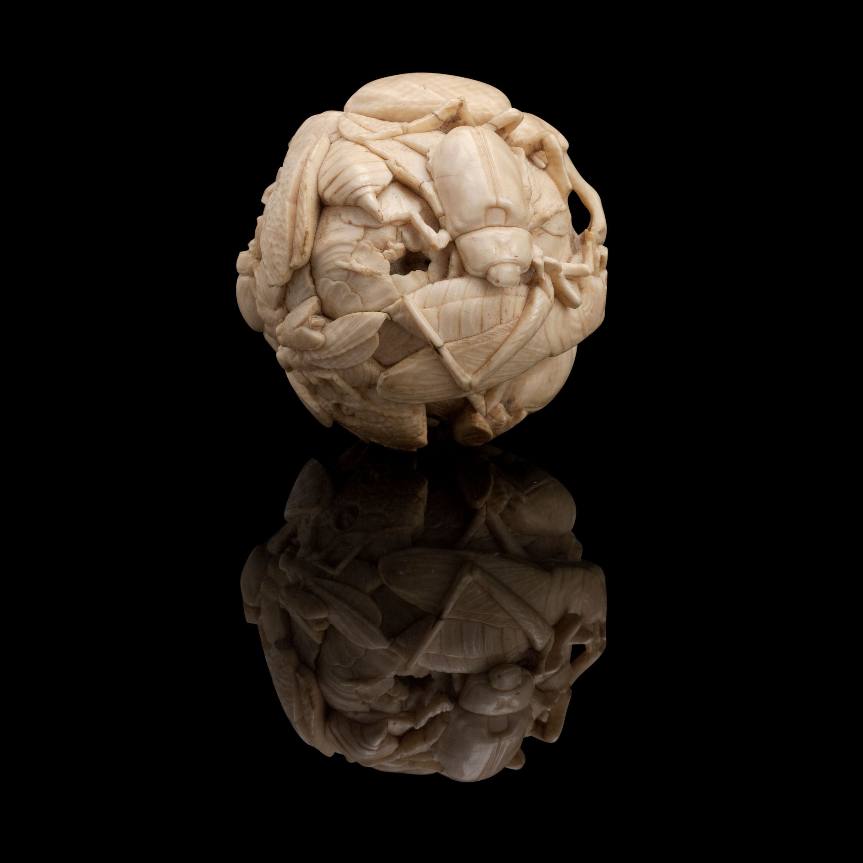 Bonhams : An ivory sphere carved with insects Meiji