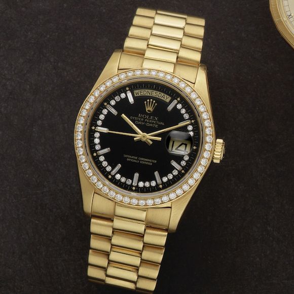 Bonhams : Rolex. An 18K gold and later diamond set automatic calendar ...