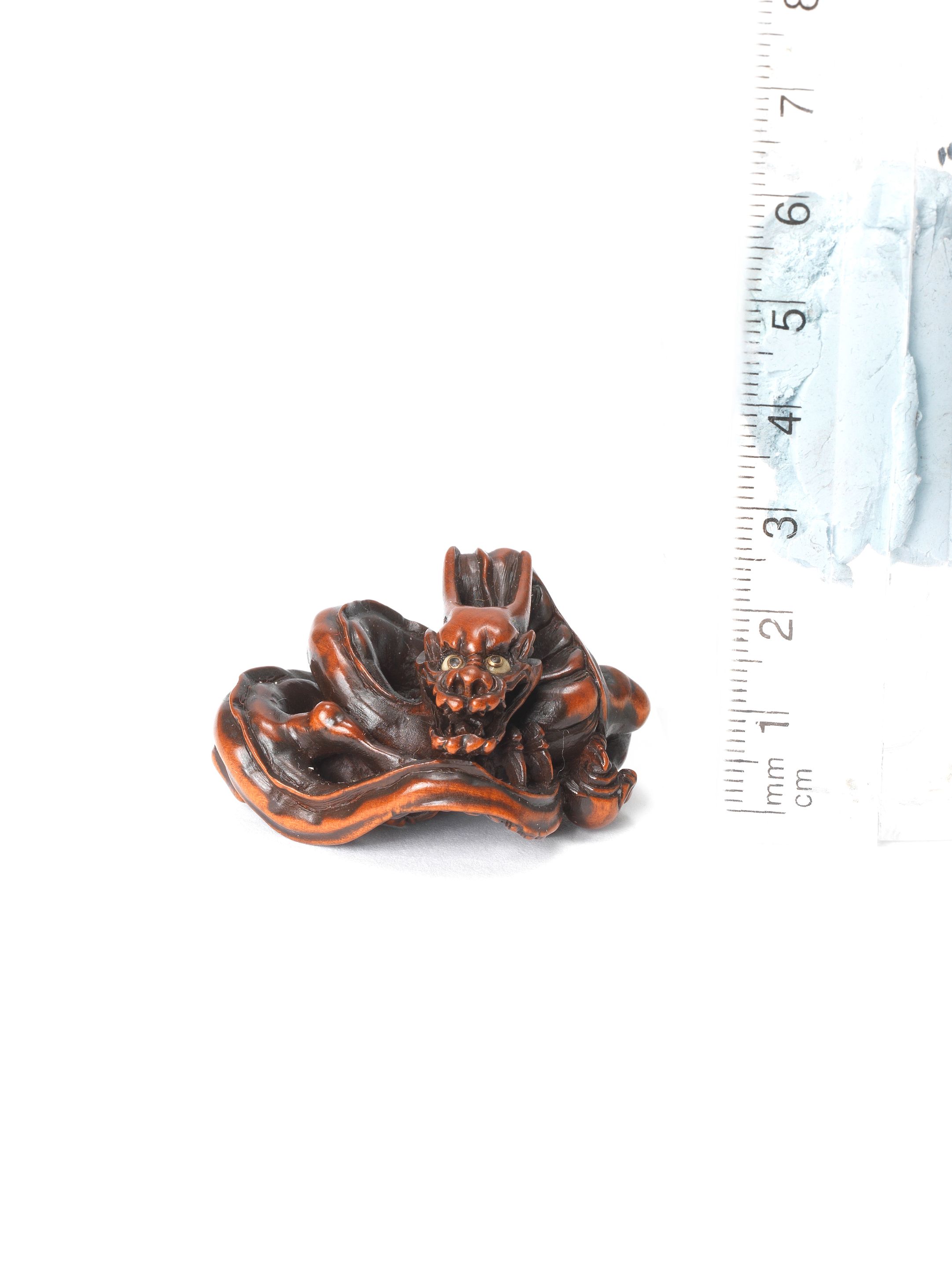 Bonhams : A wood netsuke of a smooth dragon By Hidari Issan, Iwashiro ...