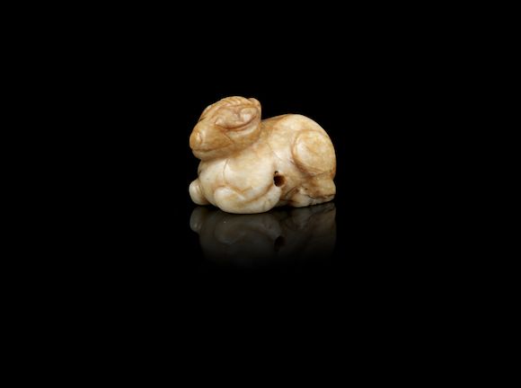 Bonhams : A mottled cream jade carving of a recumbent mythical beast ...