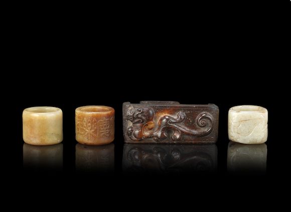 Bonhams : Three jade archer's rings and a russet jade 'chilong' sword ...