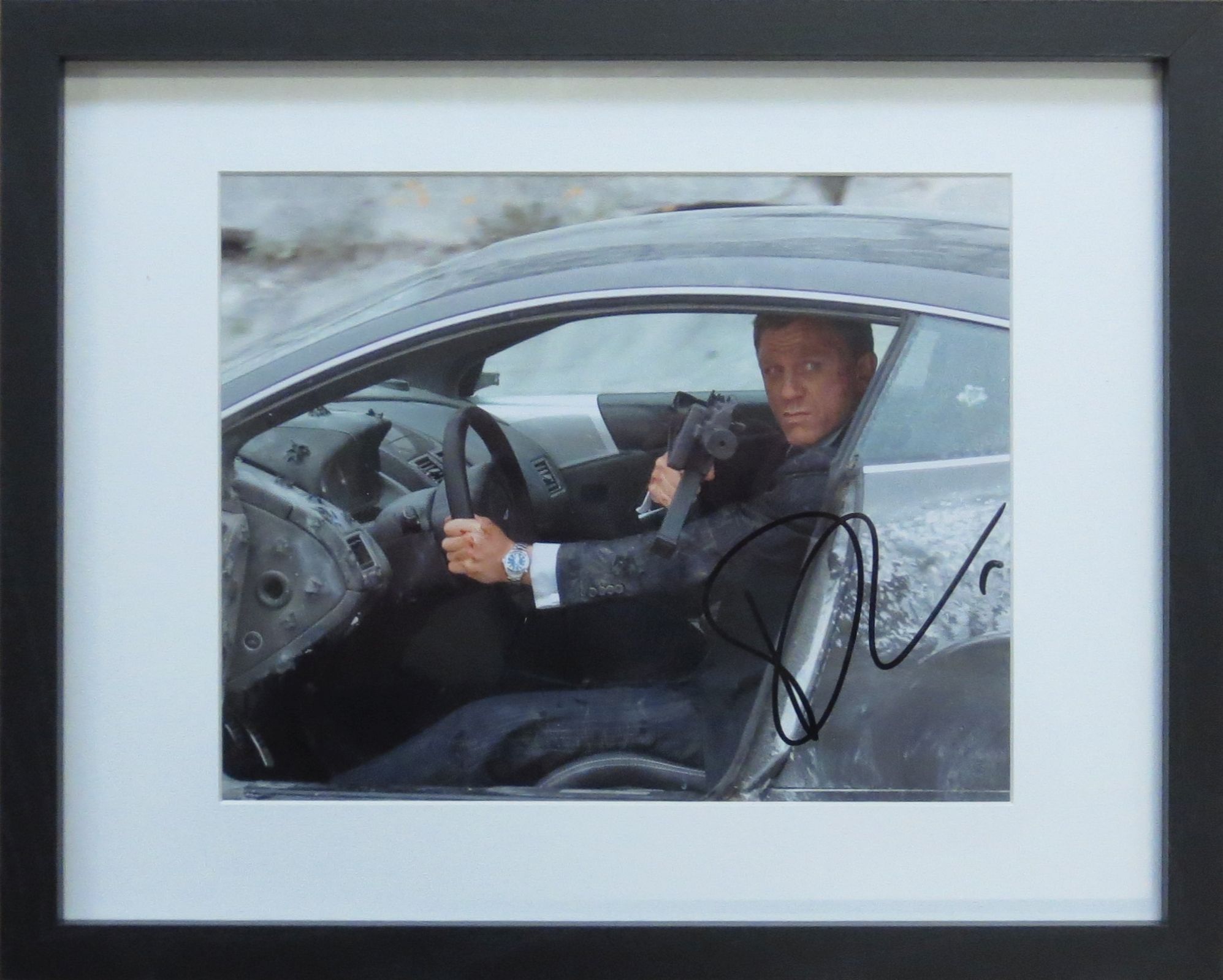 Bonhams Cars : A signed photograph of Daniel Craig with the 007 Aston ...