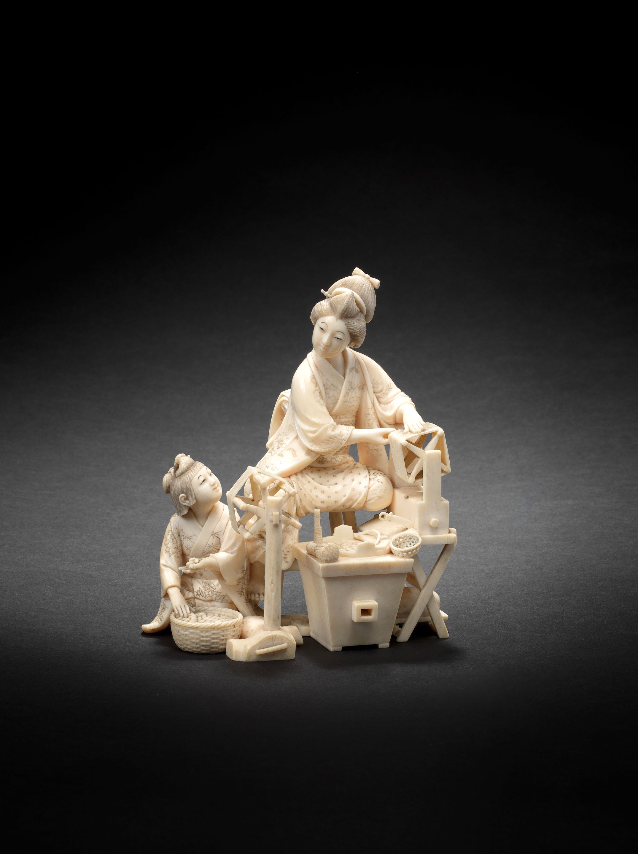 Bonhams : An ivory okimono figure group of a woman and child By Yoshida ...