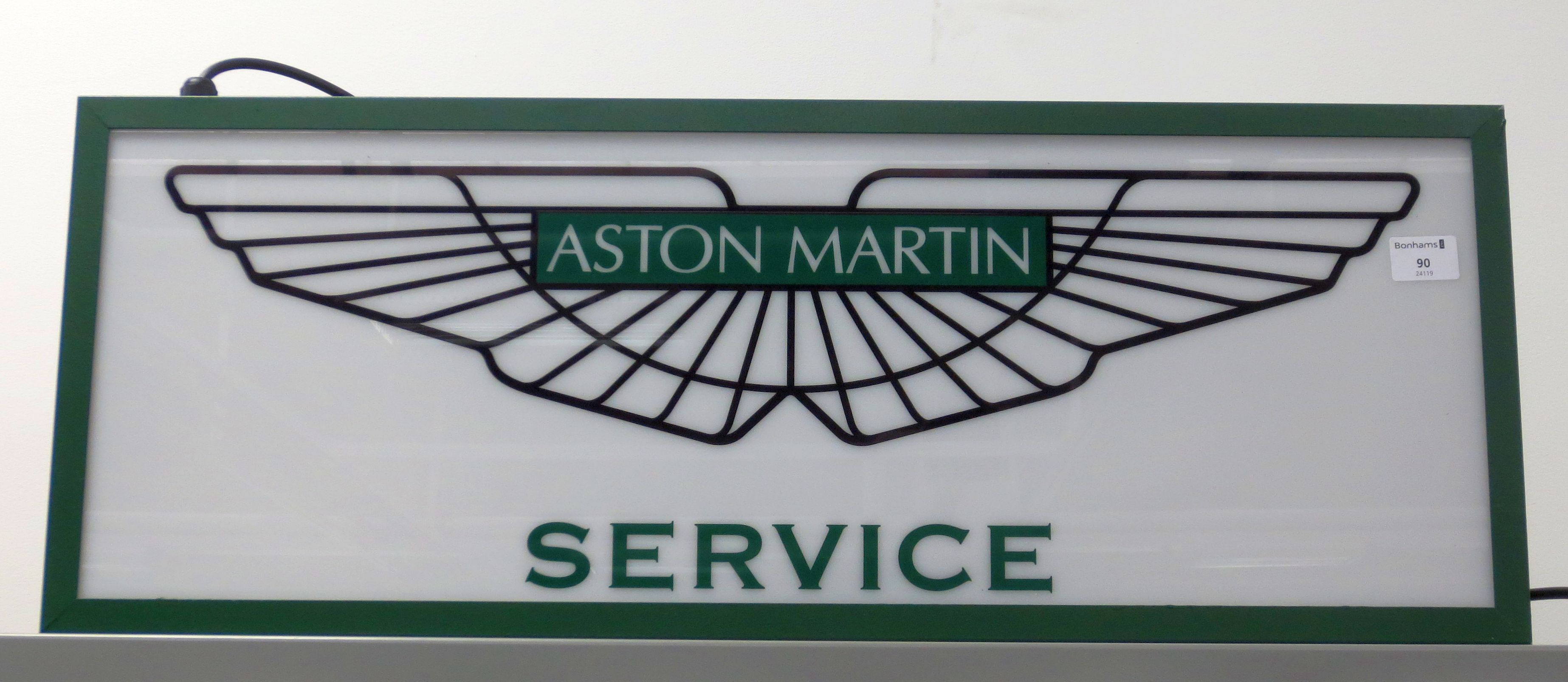 Bonhams Cars : An 'Aston Martin Service' illuminating sign,