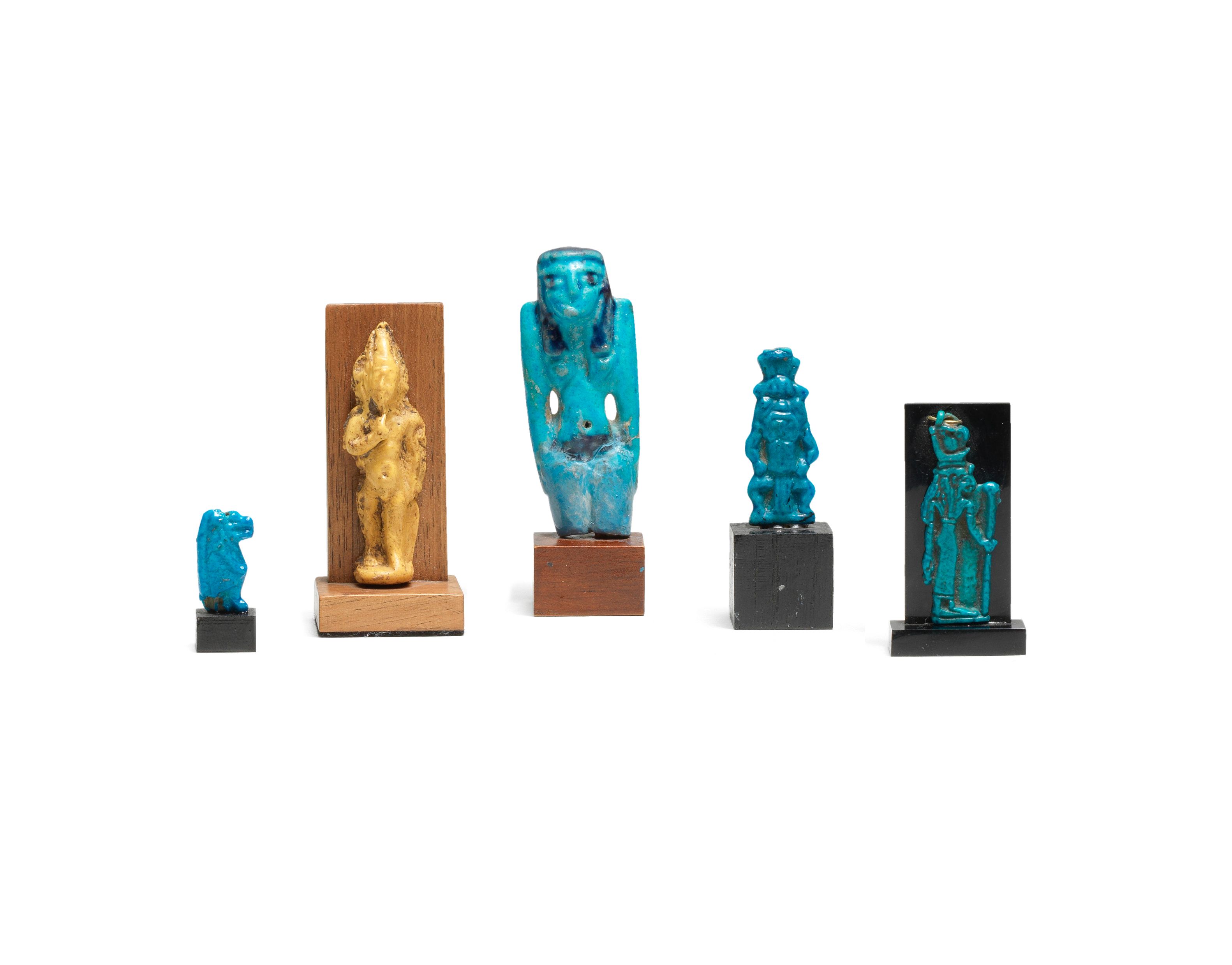 Bonhams : An Egyptian glazed composition concubine, an Egyptian yellow ...