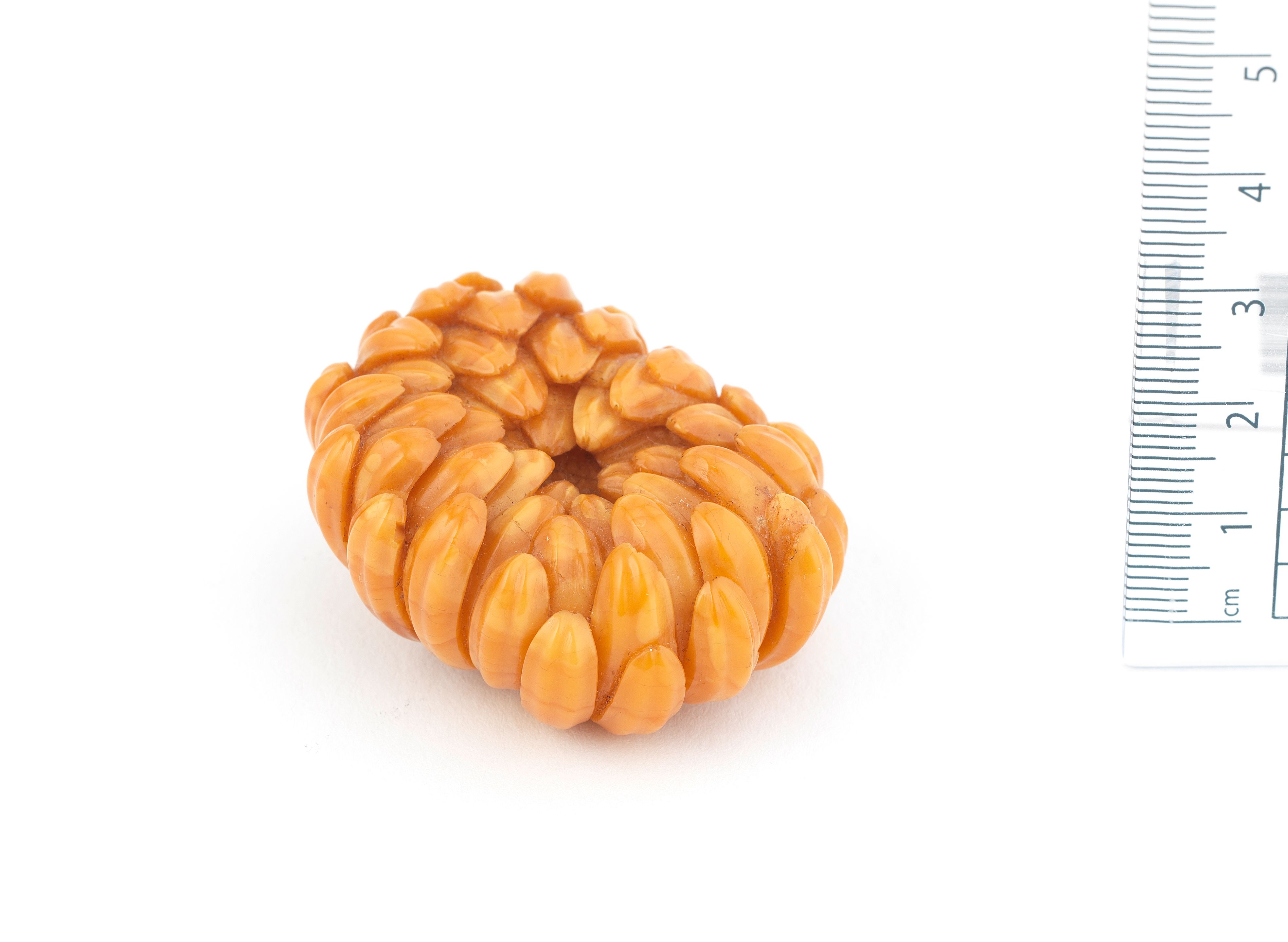 Bonhams : An amber netsuke of a chrysanthemum bloom By Kaigyokusai ...