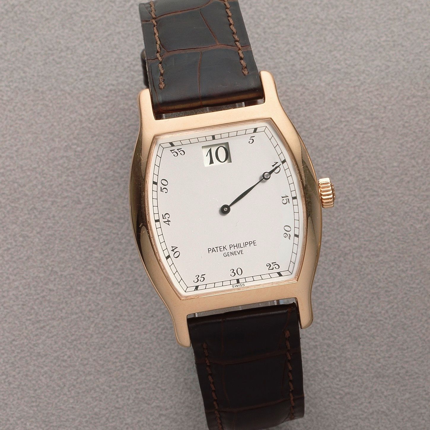 Bonhams : Patek Philippe. An 18K rose gold manual wind tonneau form ...