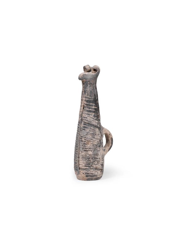Bonhams : An Amlash black burnished pottery musical instrument