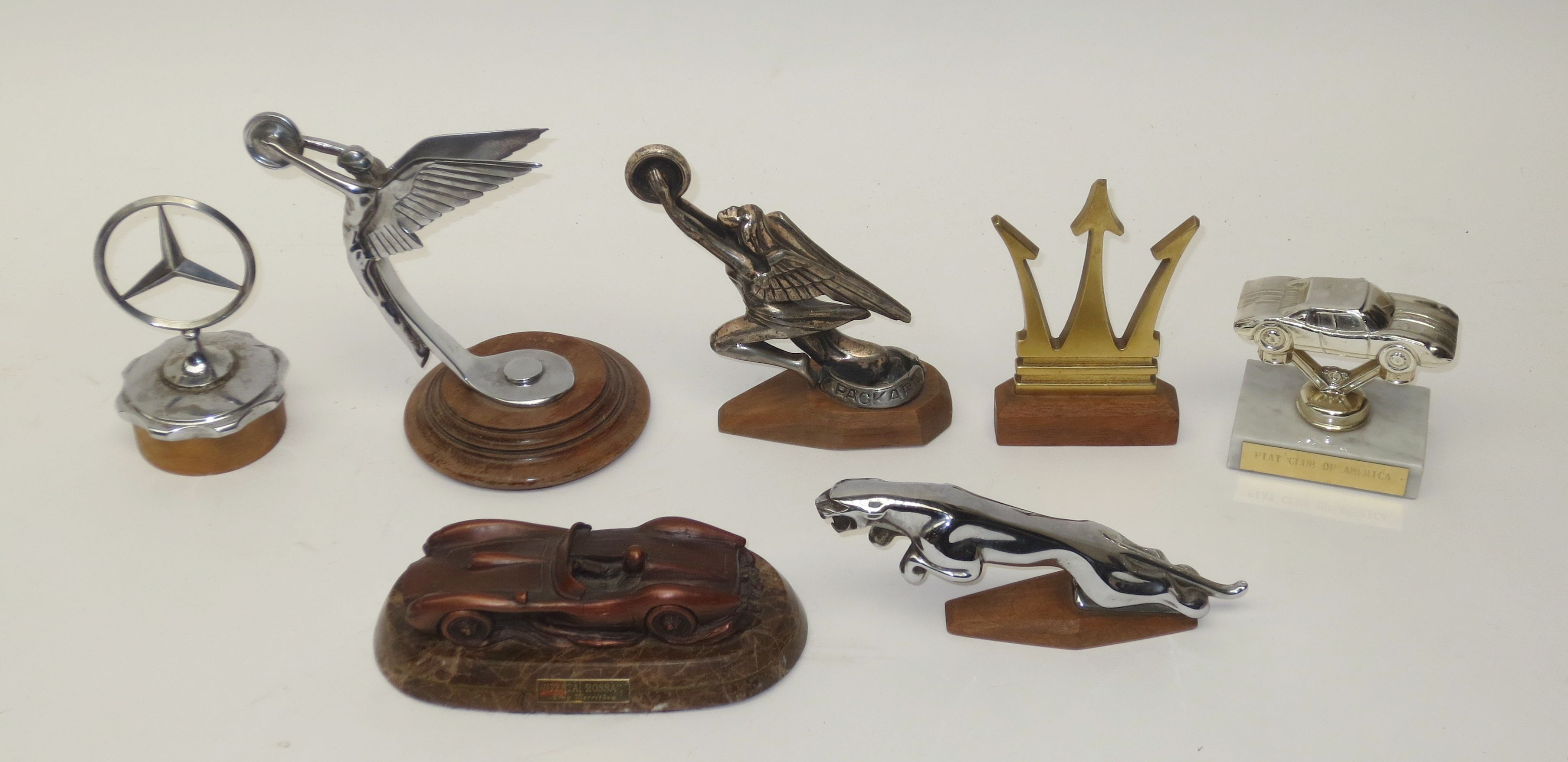 Bonhams Cars : Seven assorted car mascots and deskpieces, ((7))