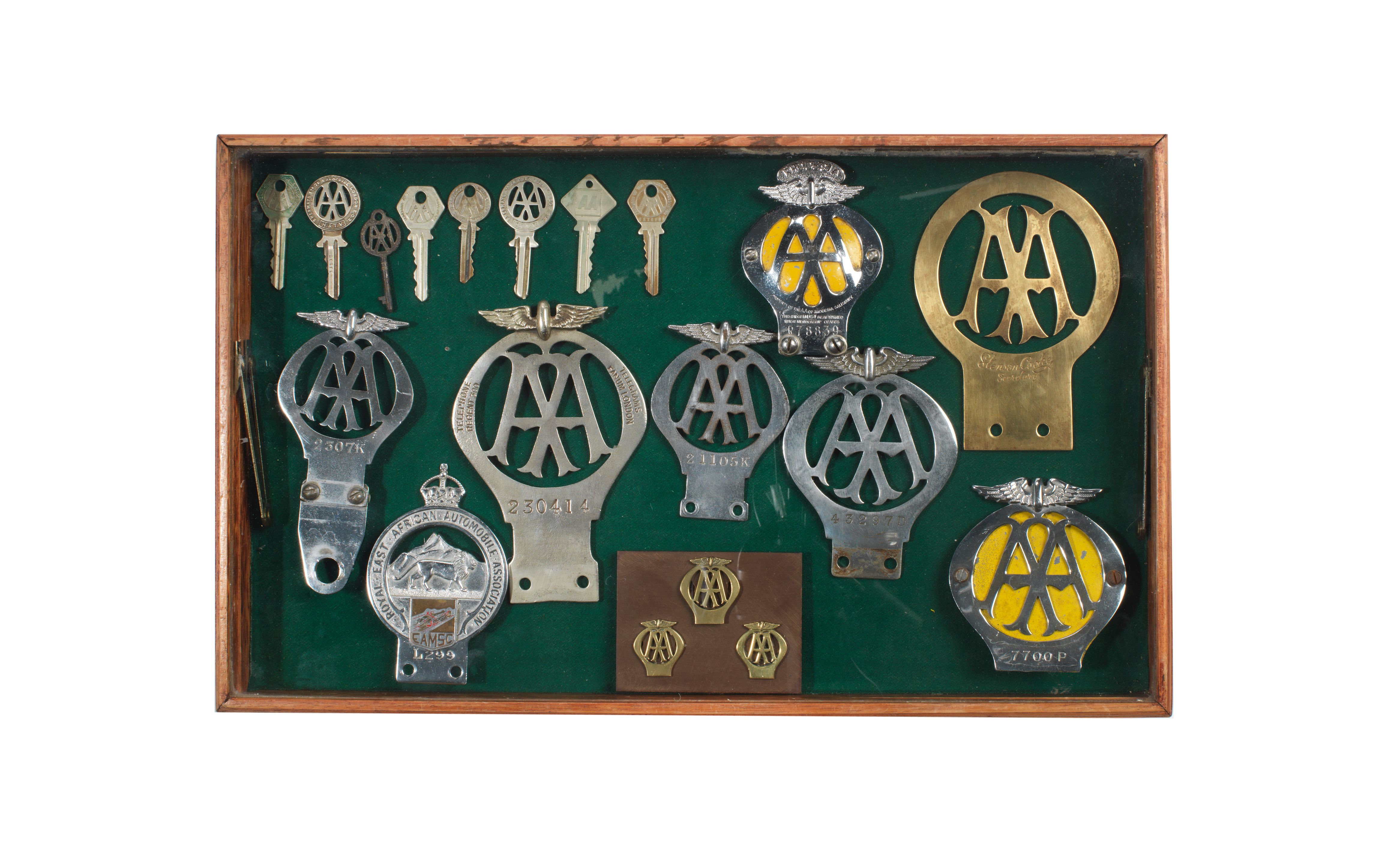 Bonhams Cars : A glazed display case of AA badges and keys, ((Qty))