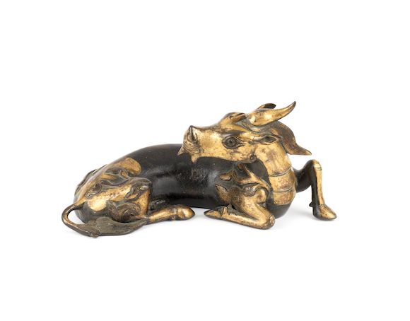 Bonhams : A parcel-gilt bronze model of a mythical beast, Xiniu Ming ...