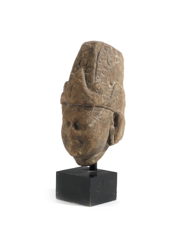 Bonhams : An Asian carved stone modeal of a male head possibly 10th century