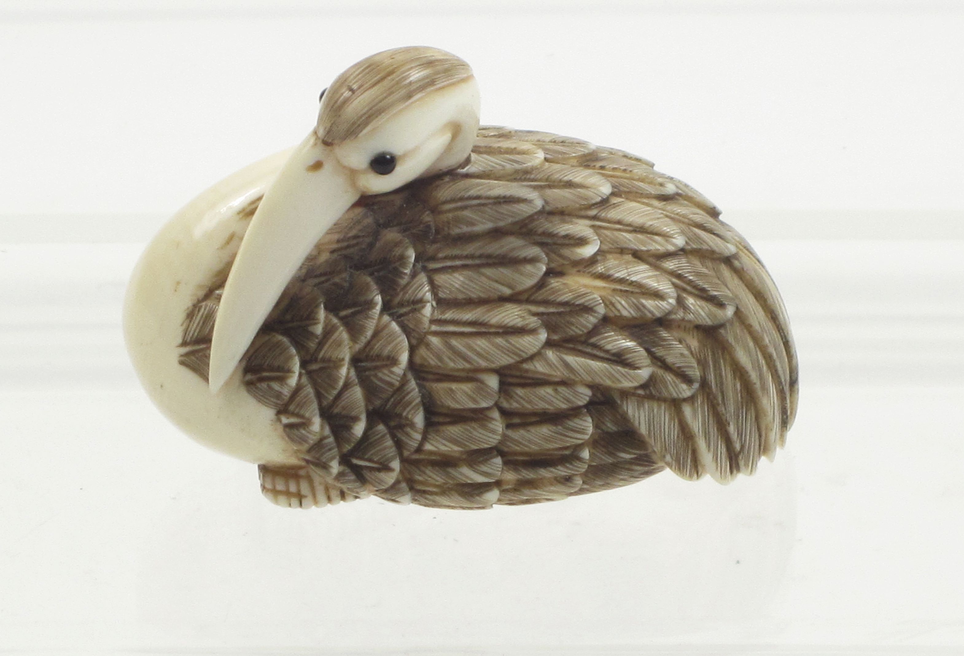 Bonhams : A carved and stained ivory netsuke of a red-crested crane ...