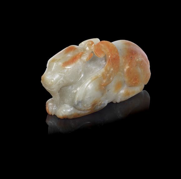 Bonhams : A mottled green and russet jade winged mythical beast Yuan to ...