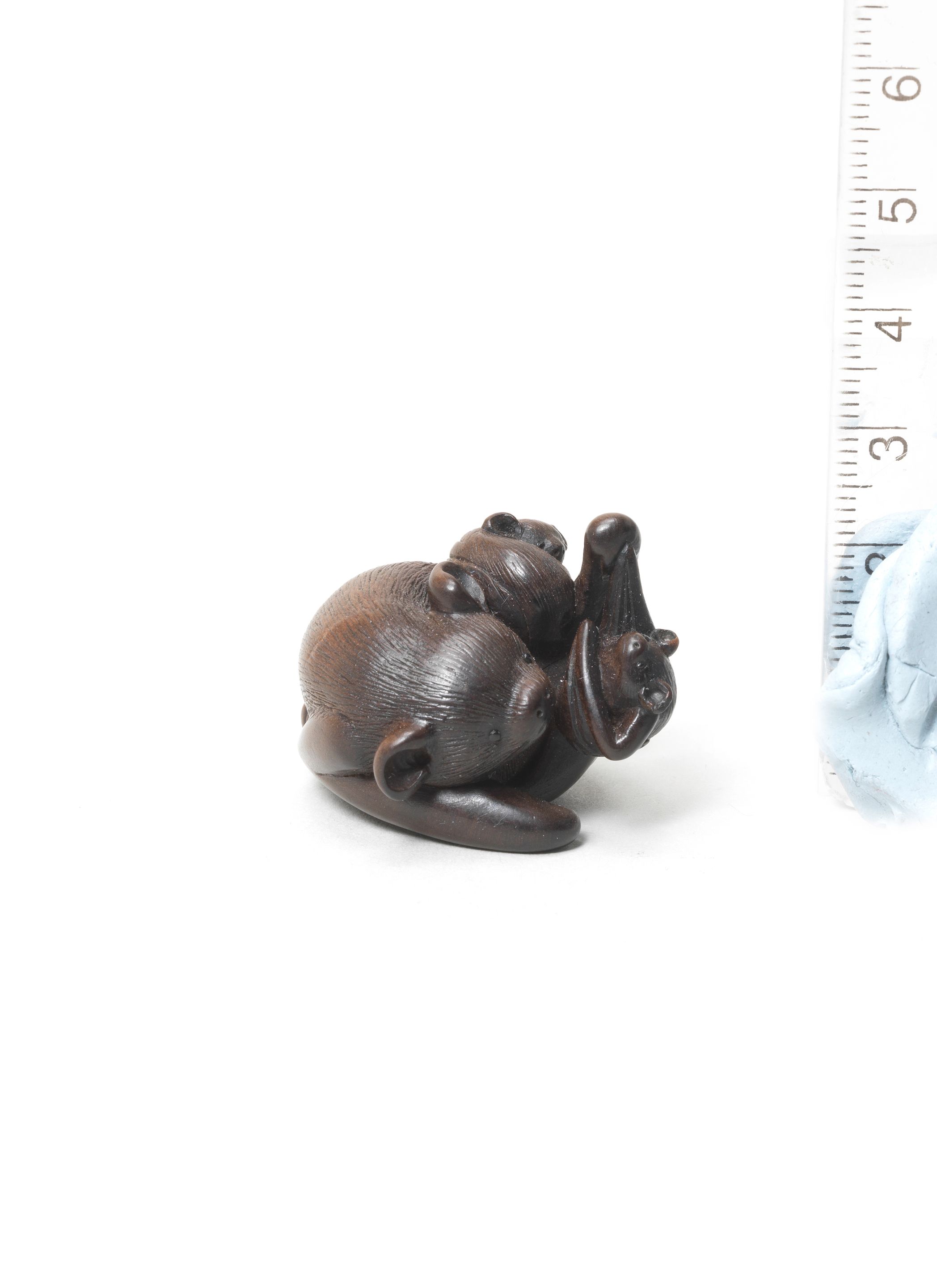 Bonhams : A wood netsuke of a bat with young By Horaku, Kyoto, 19th century