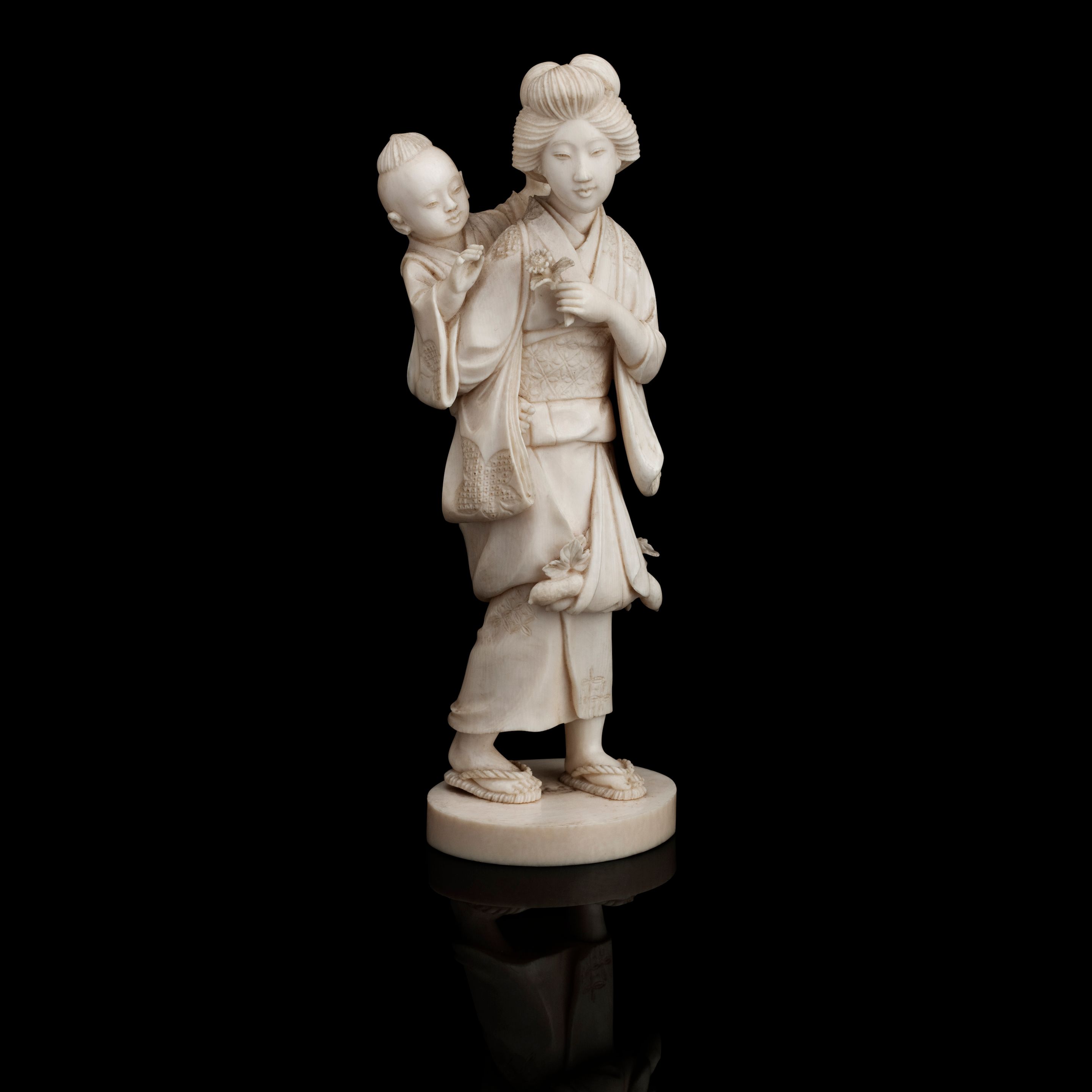 Bonhams : A carved ivory okimono of a lady and child By Sangyoku, Meiji era