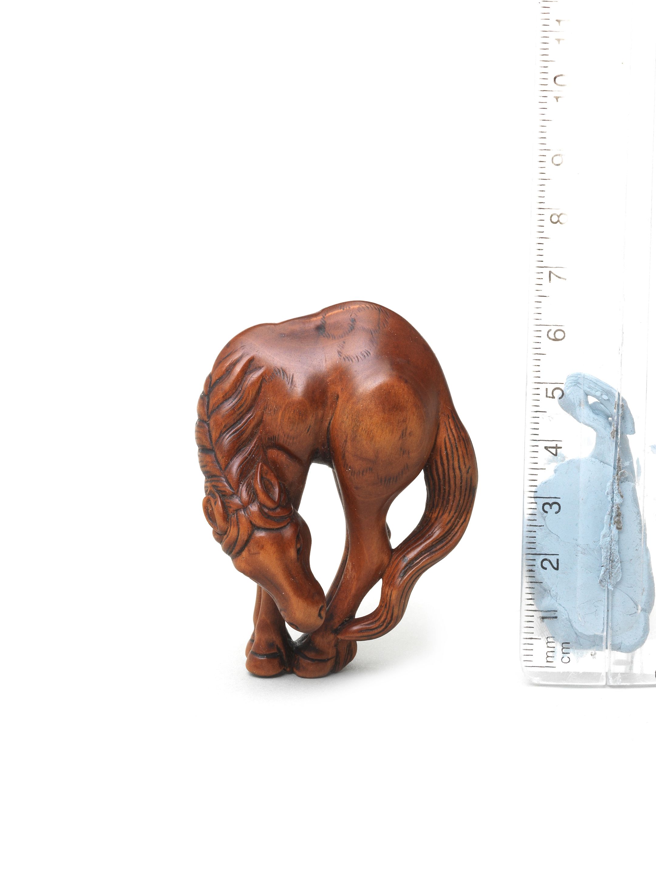 Bonhams : A boxwood netsuke of a grazing horse Early 19th century