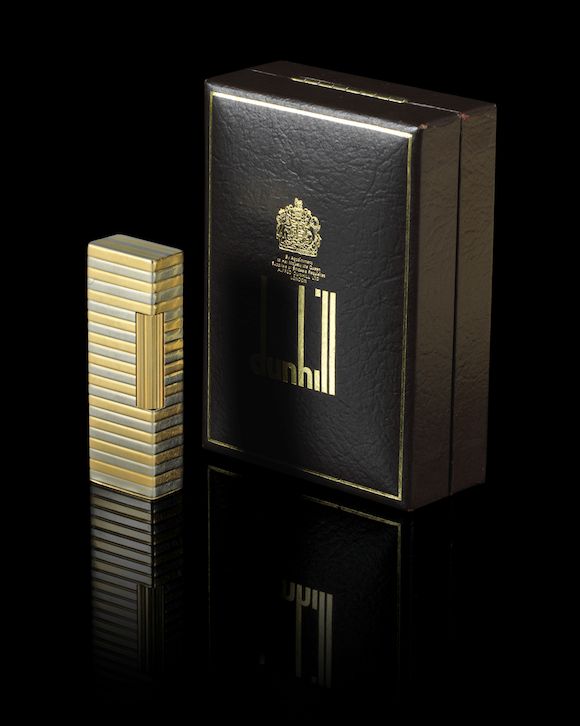 Bonhams : DUNHILL: An 18 carat gold 'Rollalite' lighter, with original ...