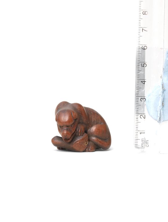 Bonhams : A wood netsuke of a wolf By Hogen Tadayoshi, Nagoya, 19th century
