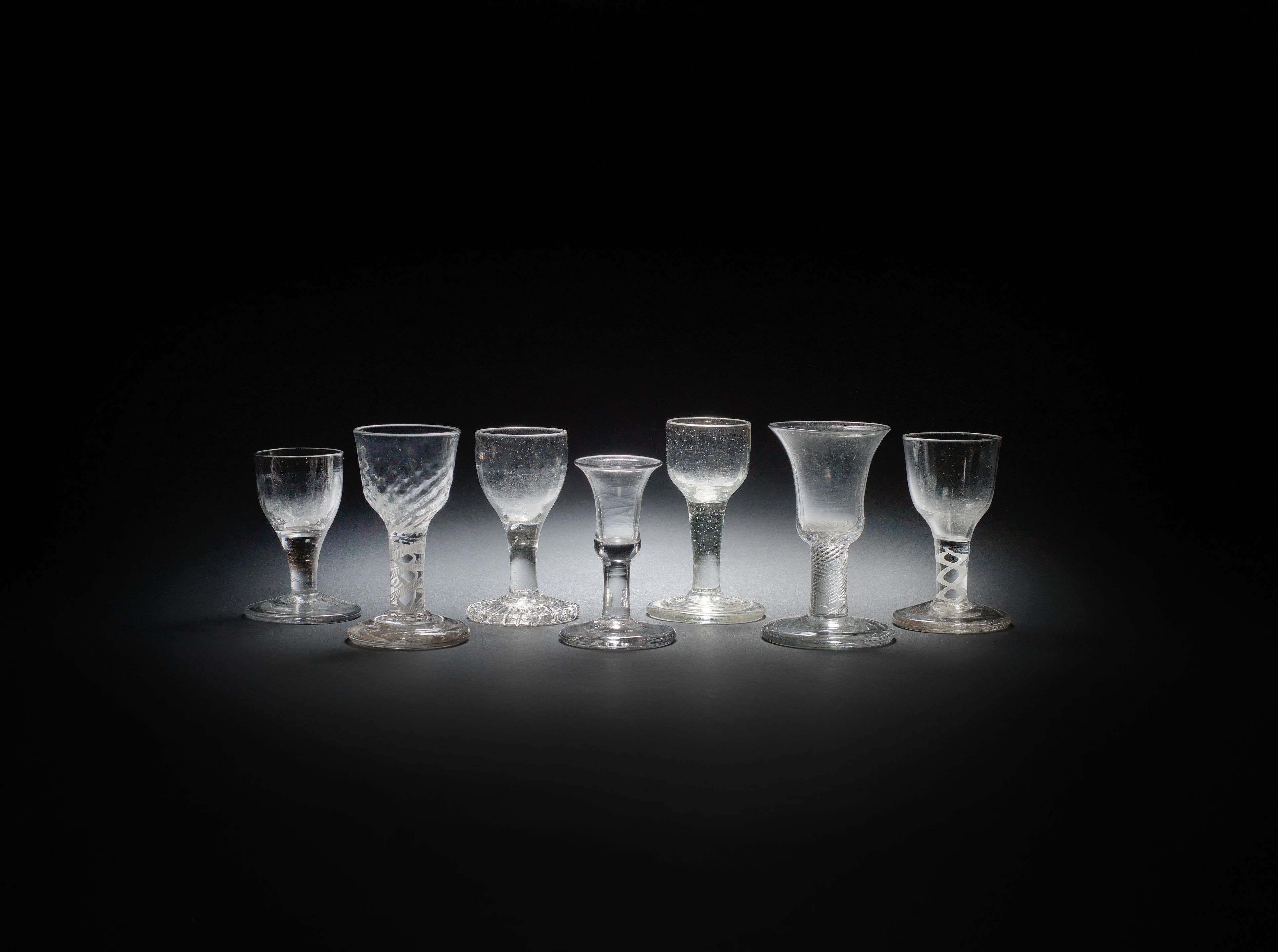 Bonhams : A collection of seven firing glasses, circa 1740-70